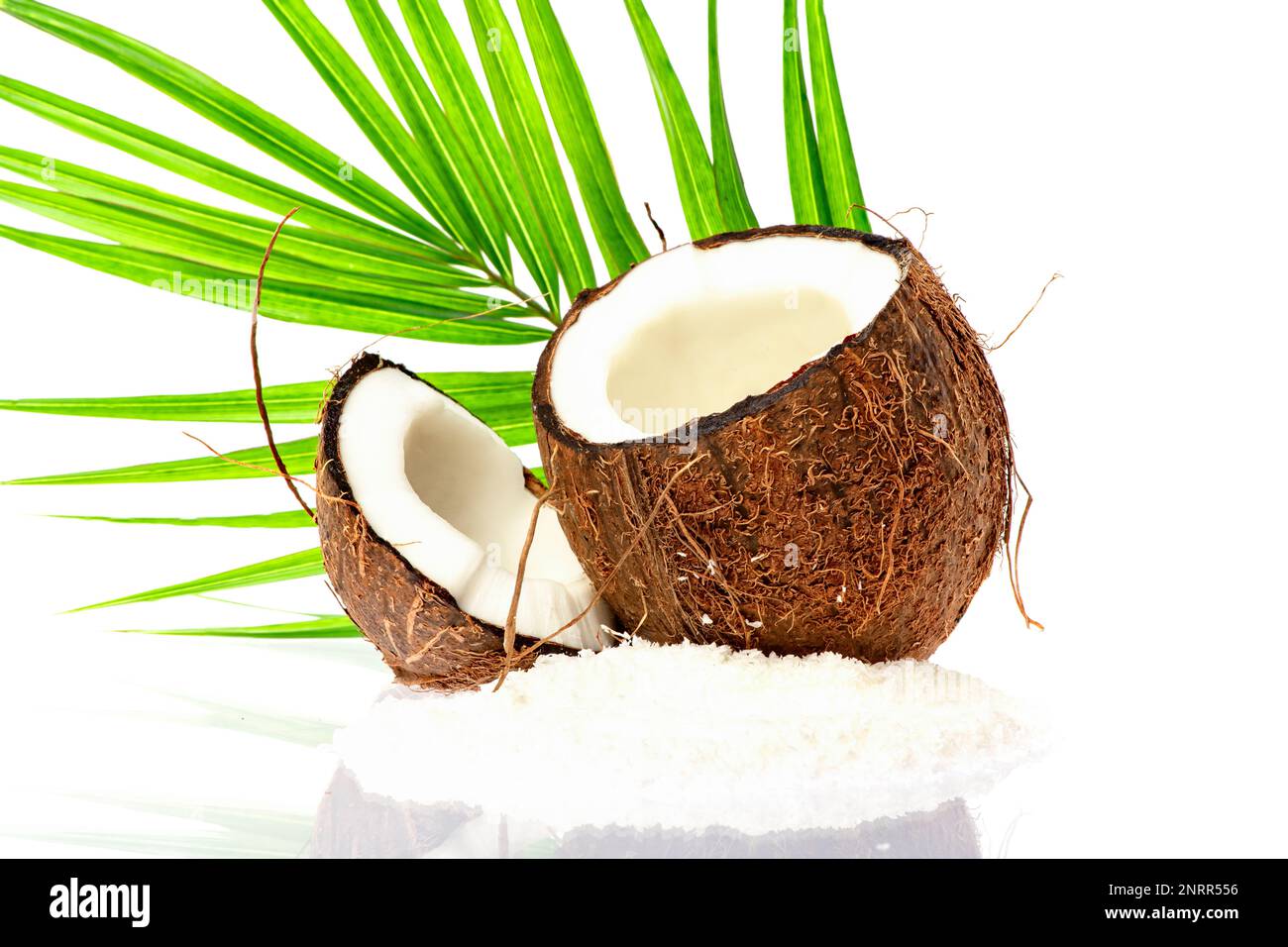 Coconut slice. Coco pieces isolated on white. Coconut with leaves Stock ...
