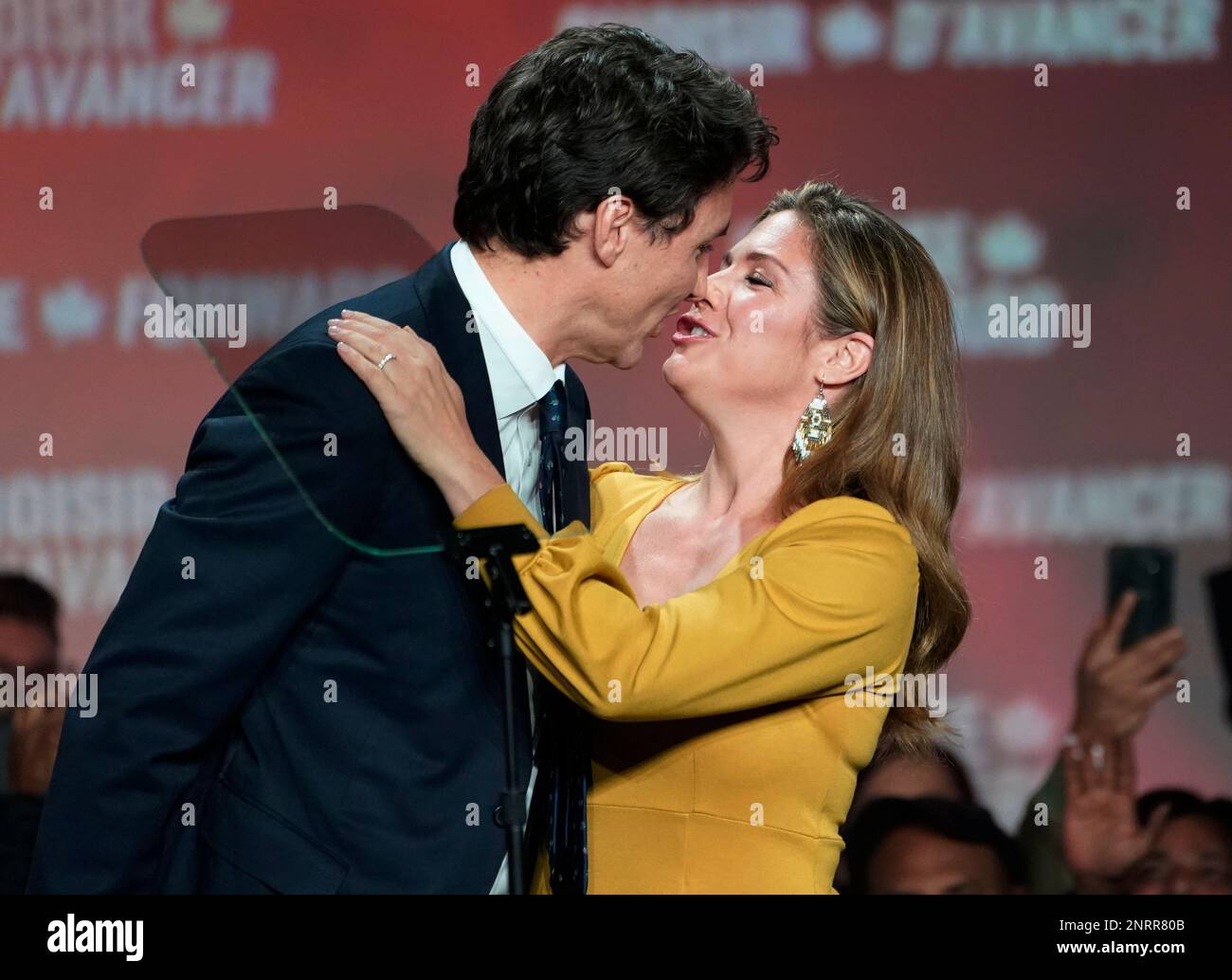 Liberal leader Justin Trudeau and wife Sophie Gregoire Trudeau kiss as ...