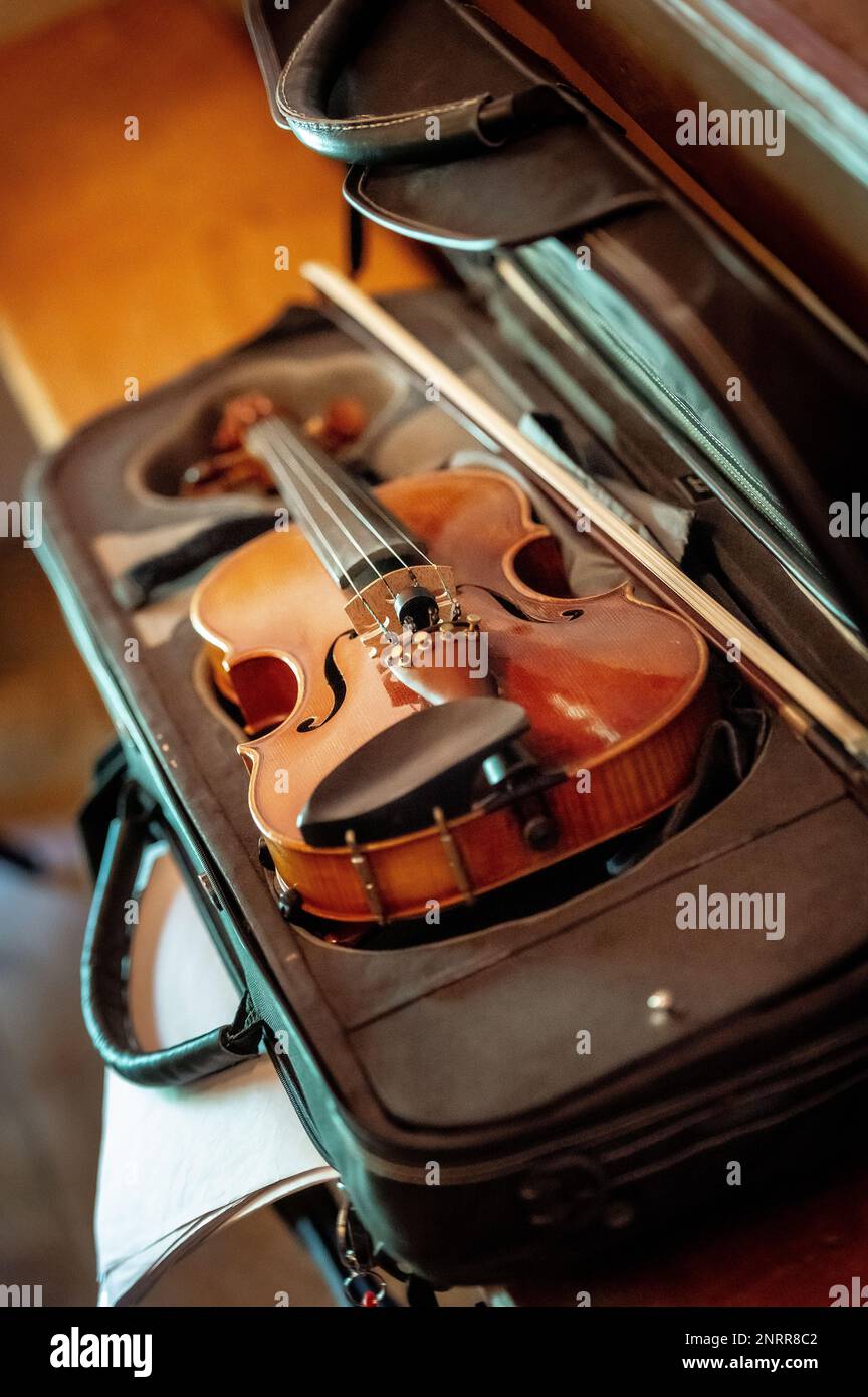 wooden violin in case with bow Stock Photo - Alamy