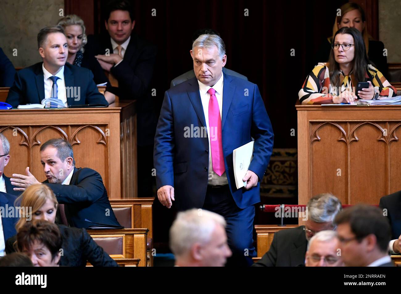 Hungarian Prime Minister Viktor Orban, center, arrives to the opening of the autumn session of ...
