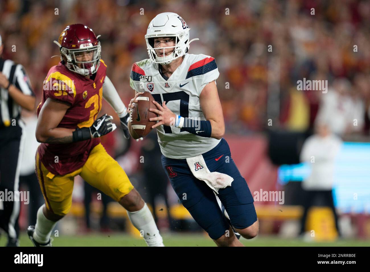 Arizona Wildcats quarterback Grant Gunnell (17) scrambles past Southern ...