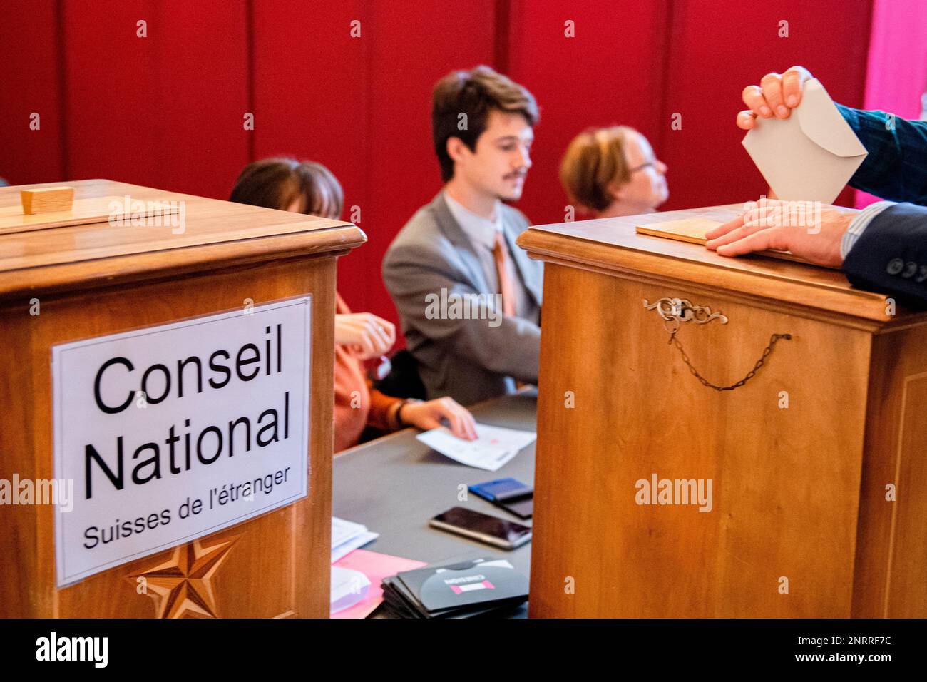 People are voting in the municipal office in Sion, Swizerland, on ...