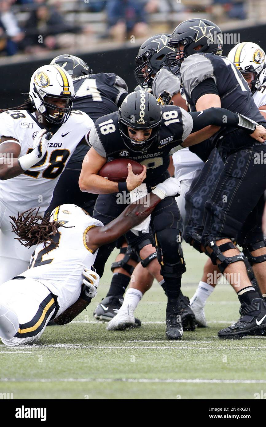 NASHVILLE, TN - OCTOBER 19: Vanderbilt Commodores quarterback Mo Hasan (18) is tackled by ...