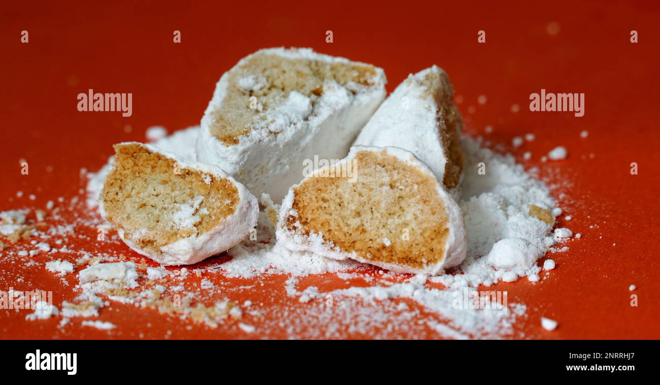 vanilla cookies crackers with sugar powder on orange background, sweet ...