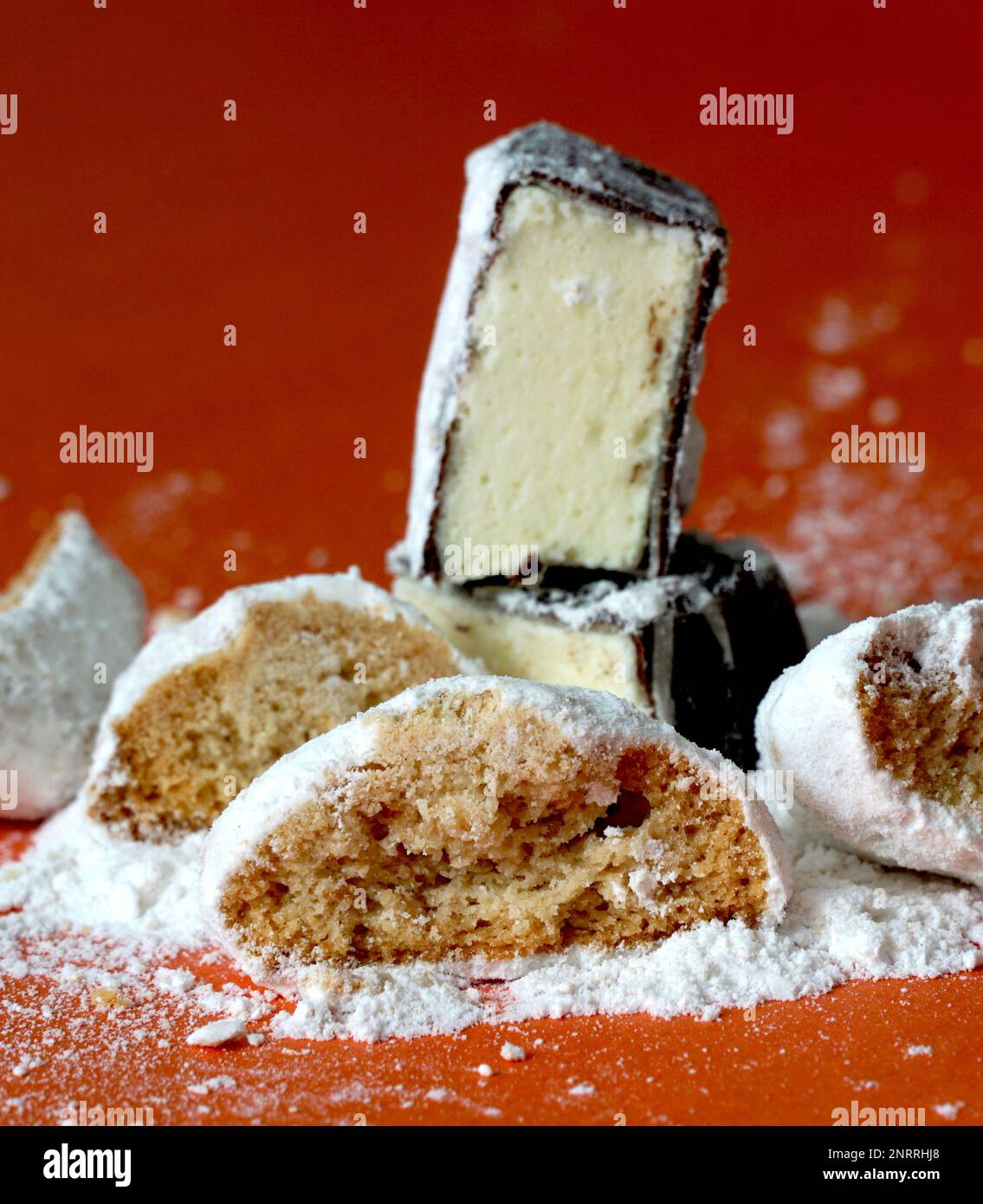 vanilla cookies crackers with sugar powder on orange background, sweet ...