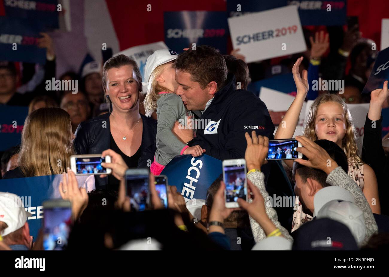 Conservative Leader Andrew Scheer hugs his daughter Mary as he stands ...
