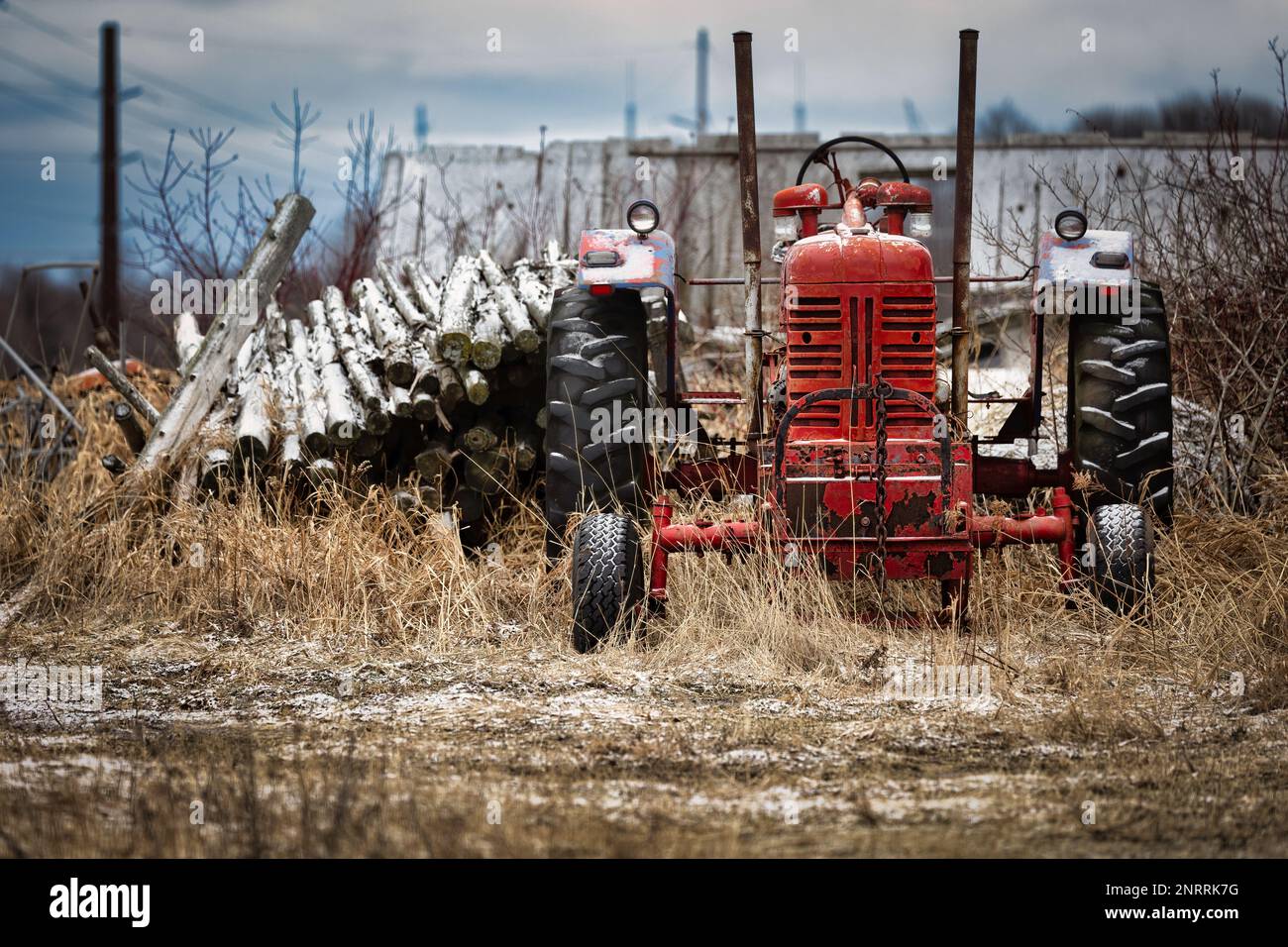 An old red tractor sits on a farm at Two Creeks near Manitowoc ...