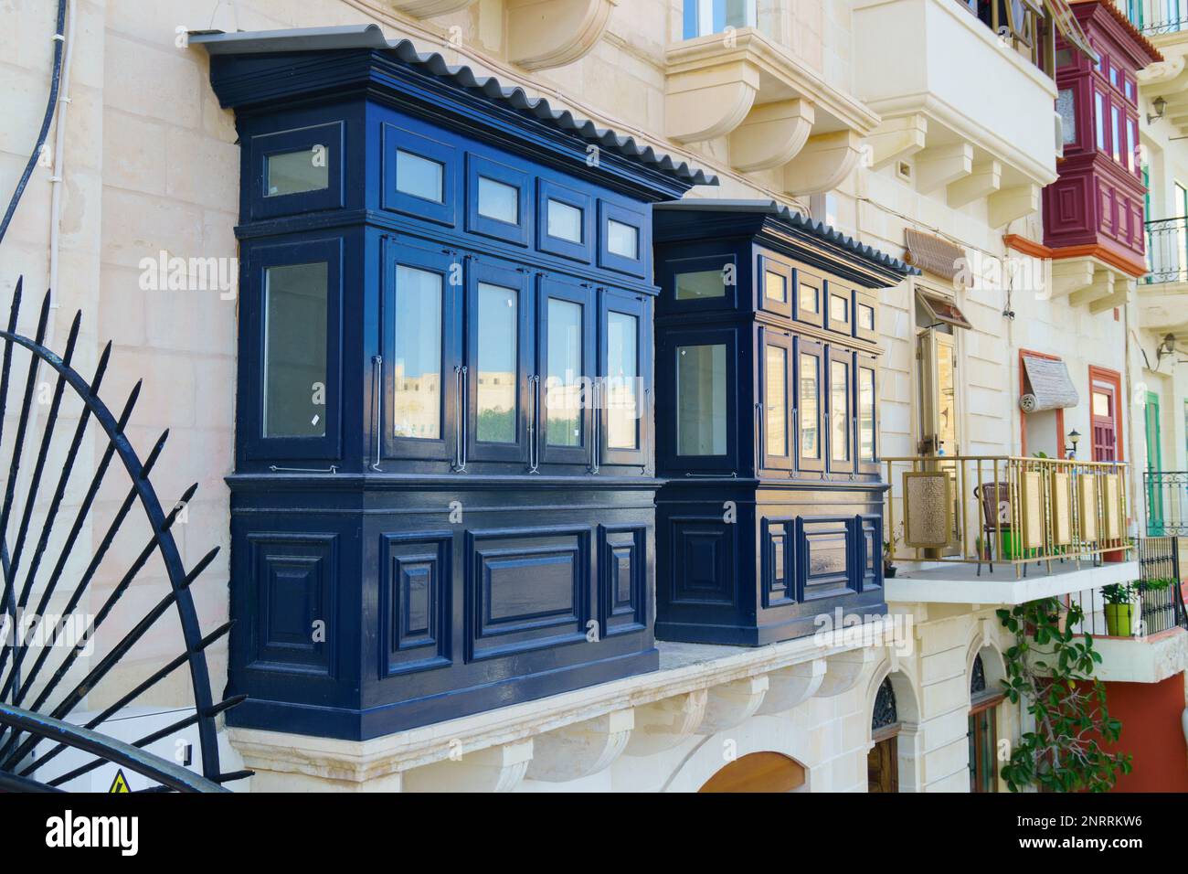 Red, green, blue colorful traditional maltese balconies yellow ...