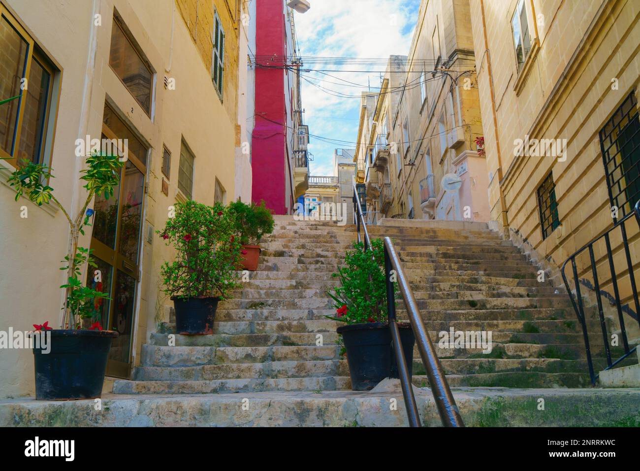 The medieval old town typical narrow street with stairs in the city ...