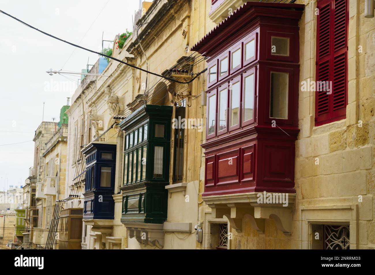 Red, green, blue colorful traditional maltese balconies yellow ...