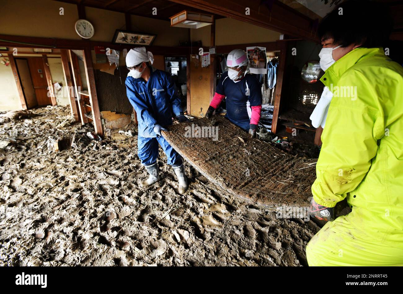 The suffers clean a house which was flooded in Nagano City, Nagano ...