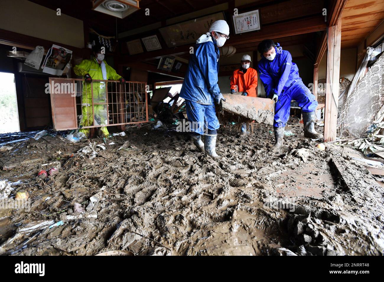 The suffers clean a house which was flooded in Nagano City, Nagano ...