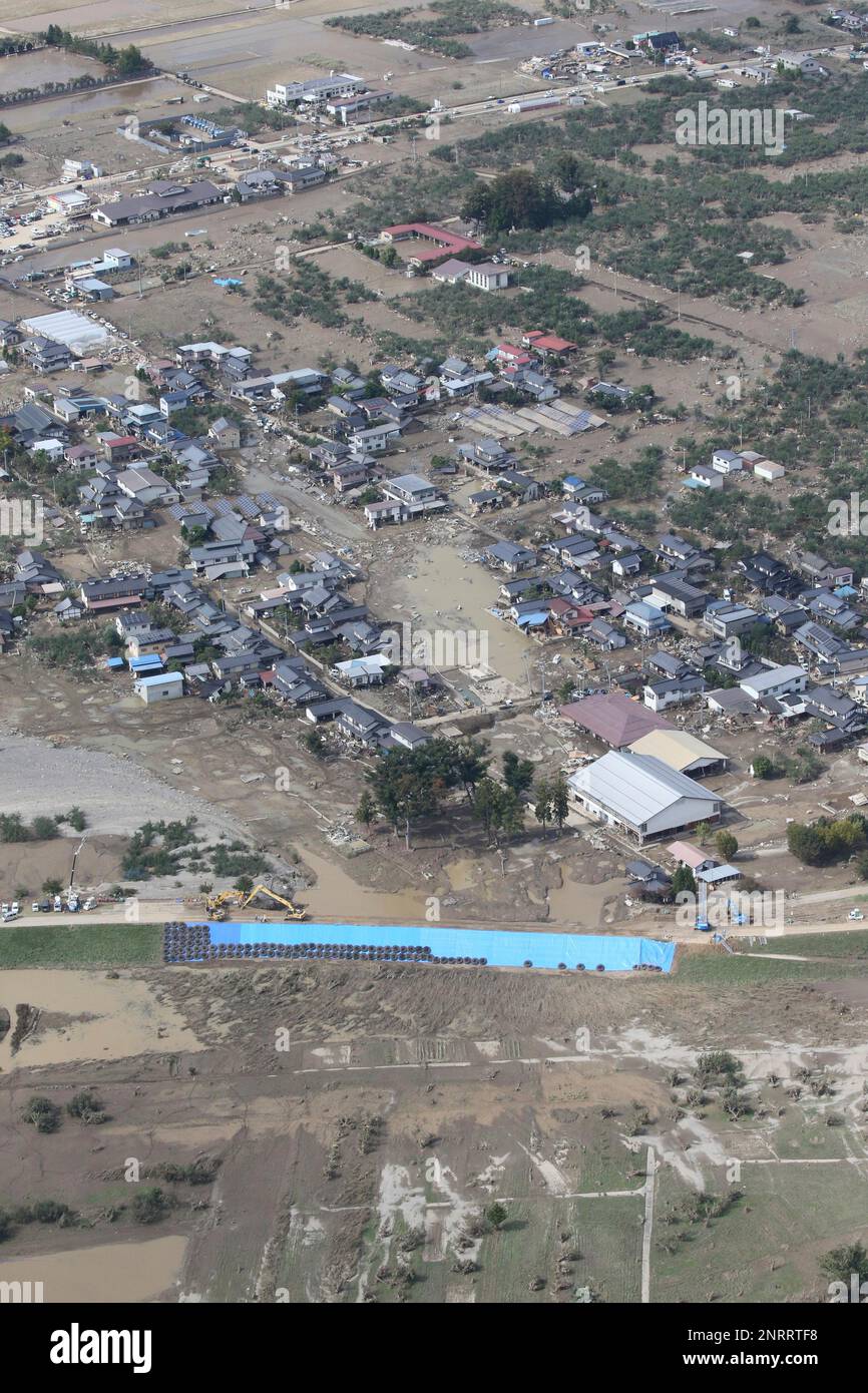 An aerial photo shows a blue sheet covering the temporary bank of ...