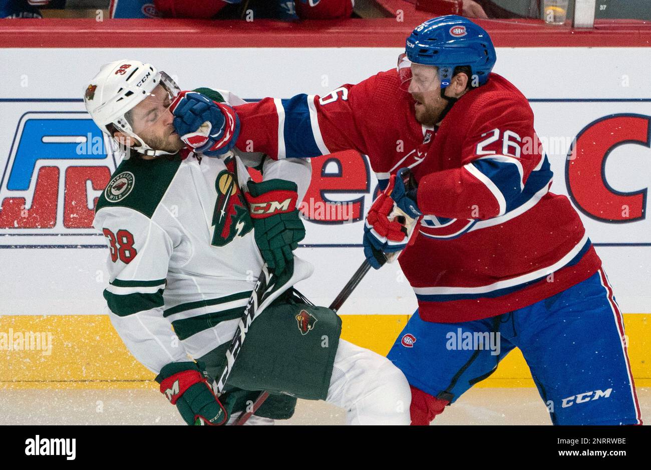 Minnesota Wild's Ryan Hartman gets a glove in the face from Montreal ...