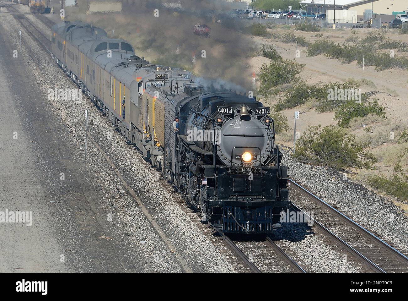 Engineer Ed Dickens leans out the window of the cab as Union Pacific ...