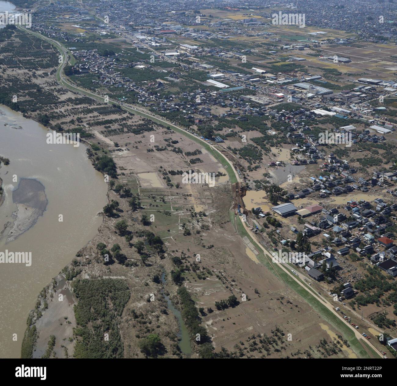 An aerial photo shows a recovery operation of destroyed banks of ...