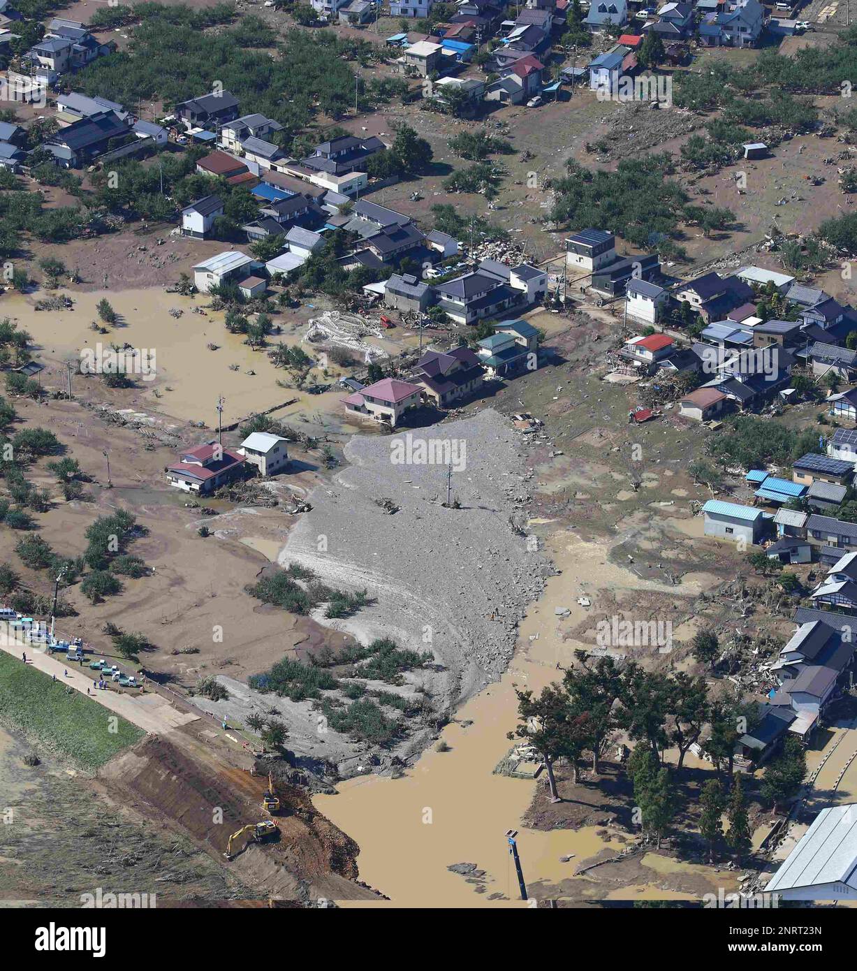 An aerial photo shows a recovery operation for destroyed banks of ...