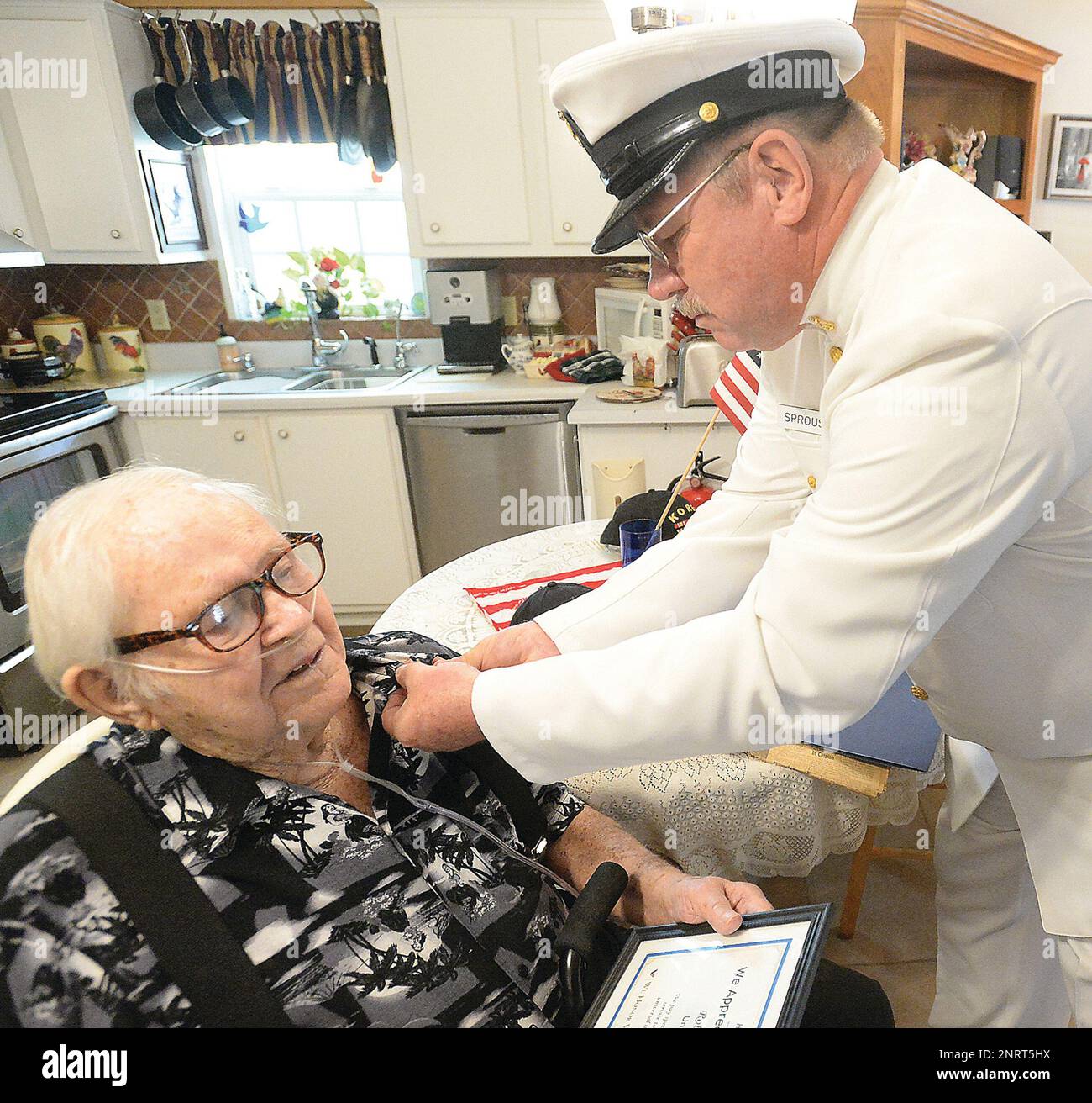 Retired U.S. Navy Senior Chief Edward Sprouse, right, who is a Hospice ...