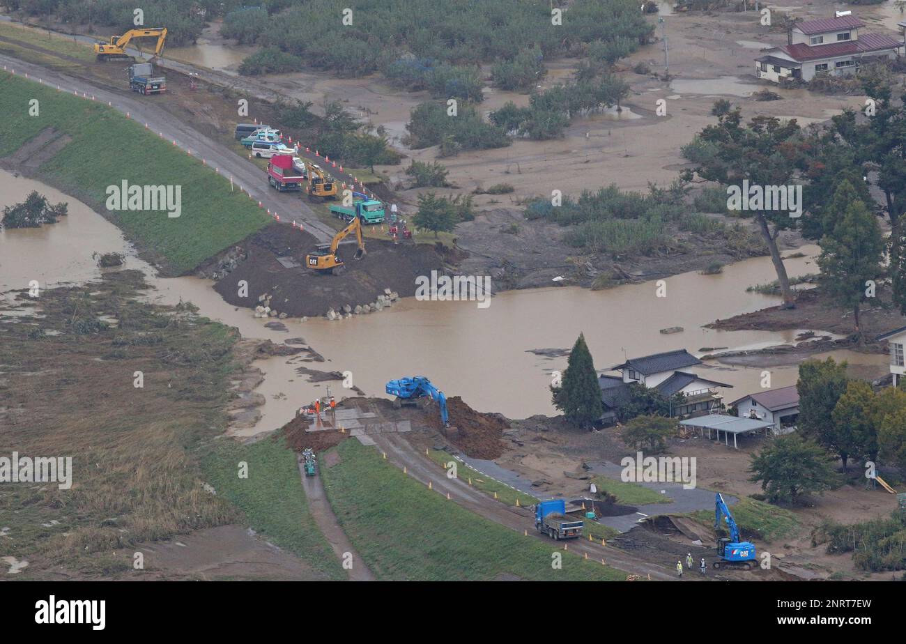 An aerial photo shows the banks of Chikuma River collapsed in Nagano ...