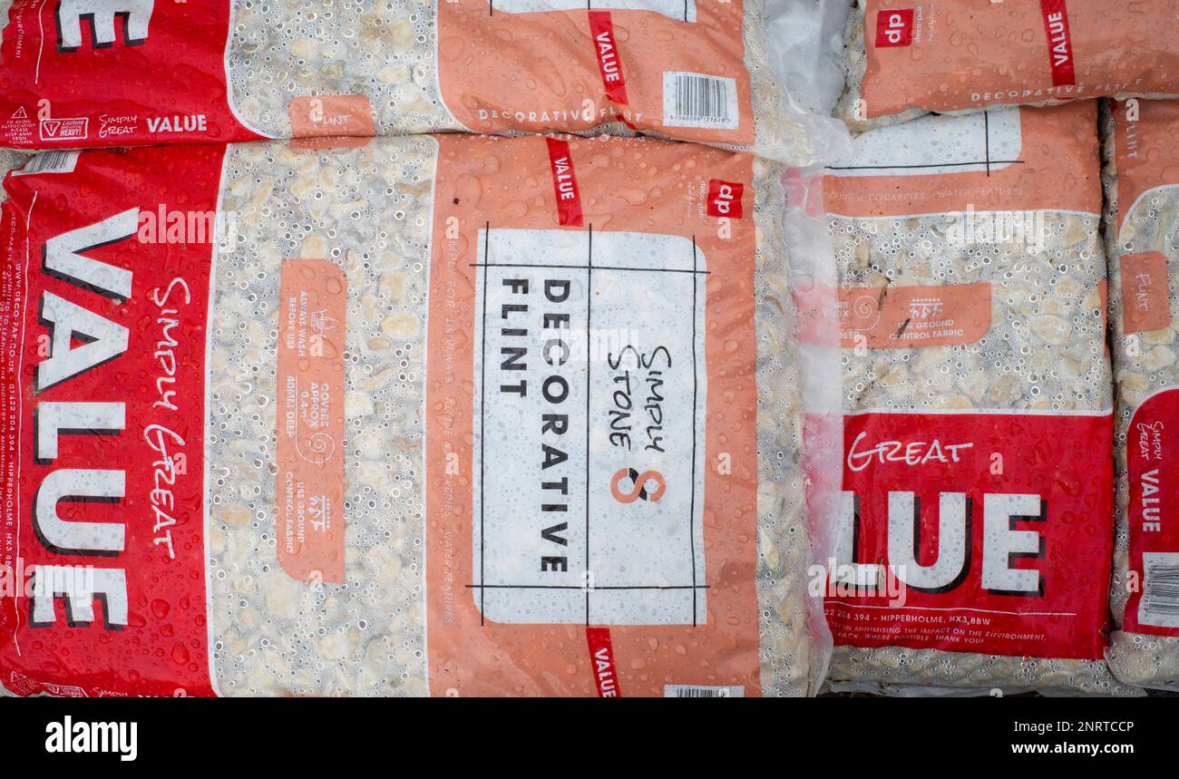 A stack of bags of simply stone decorative flint for top dressing pots ...