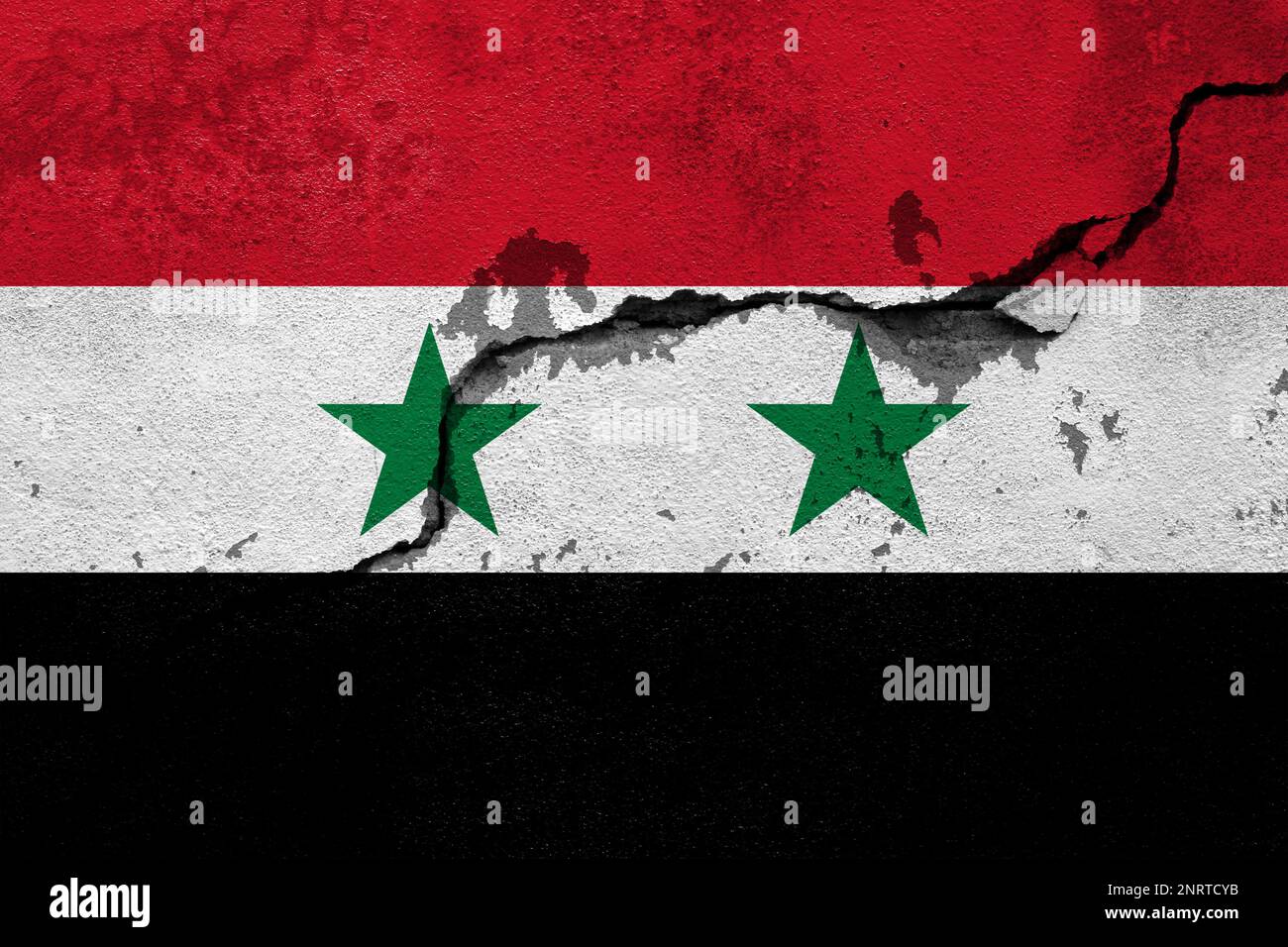 Earthquakes in Syria, flag Syria on a wall with cracks from an ...