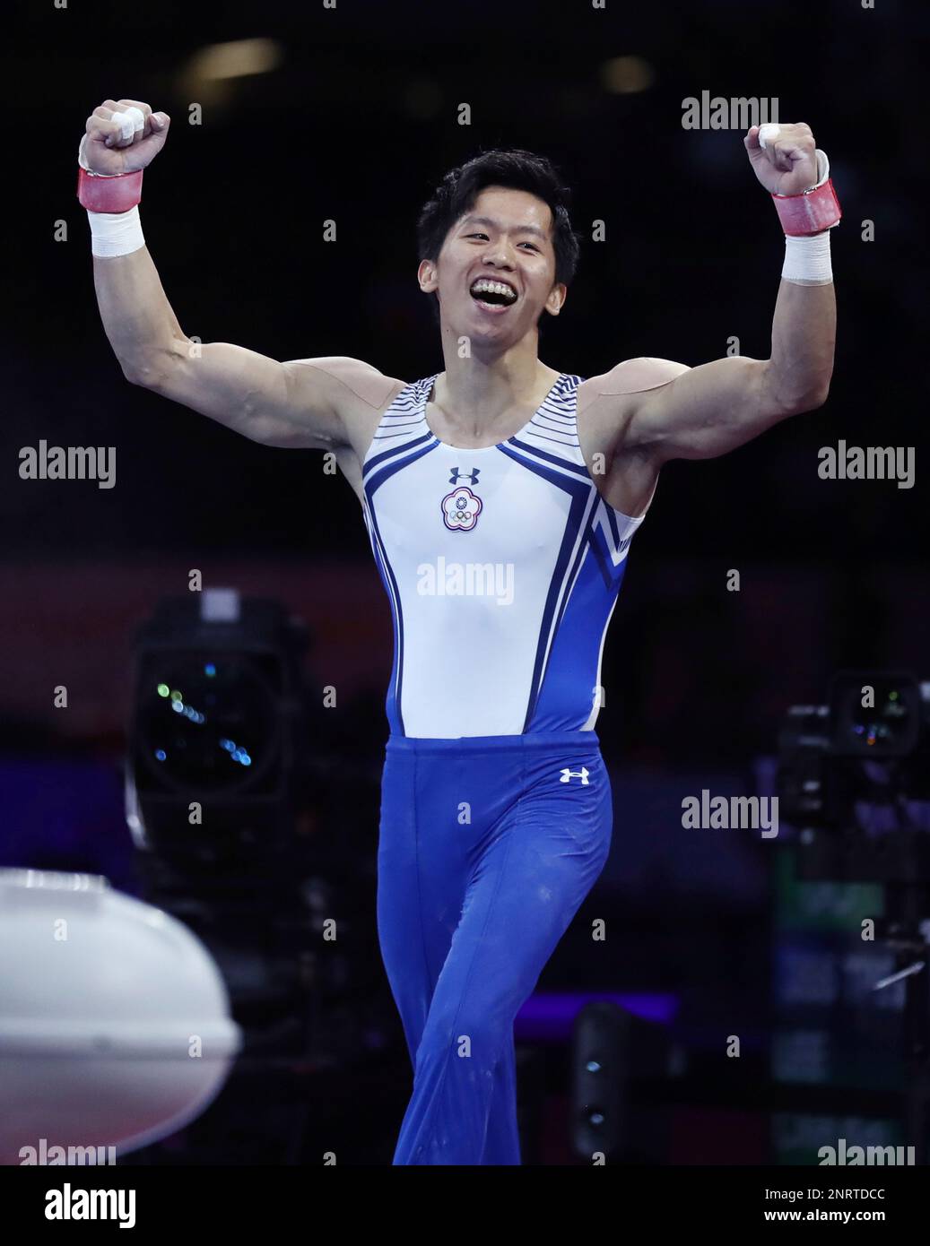 Chih Kai Lee of Chinese Taipei reacts after performing final apparatus of men pommel horse in ...