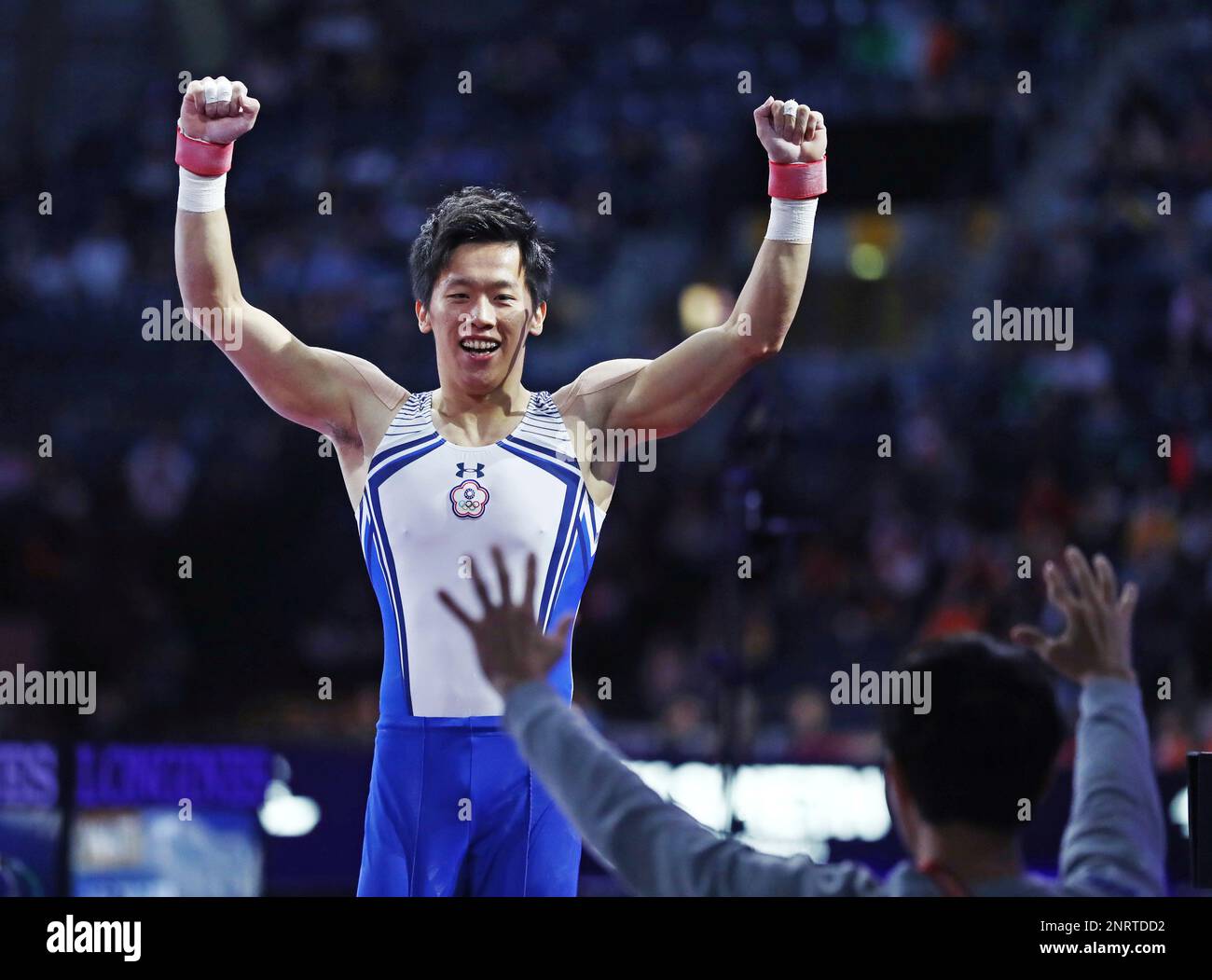 Chih Kai Lee of Chinese Taipei reacts after performing final apparatus of men pommel horse in ...