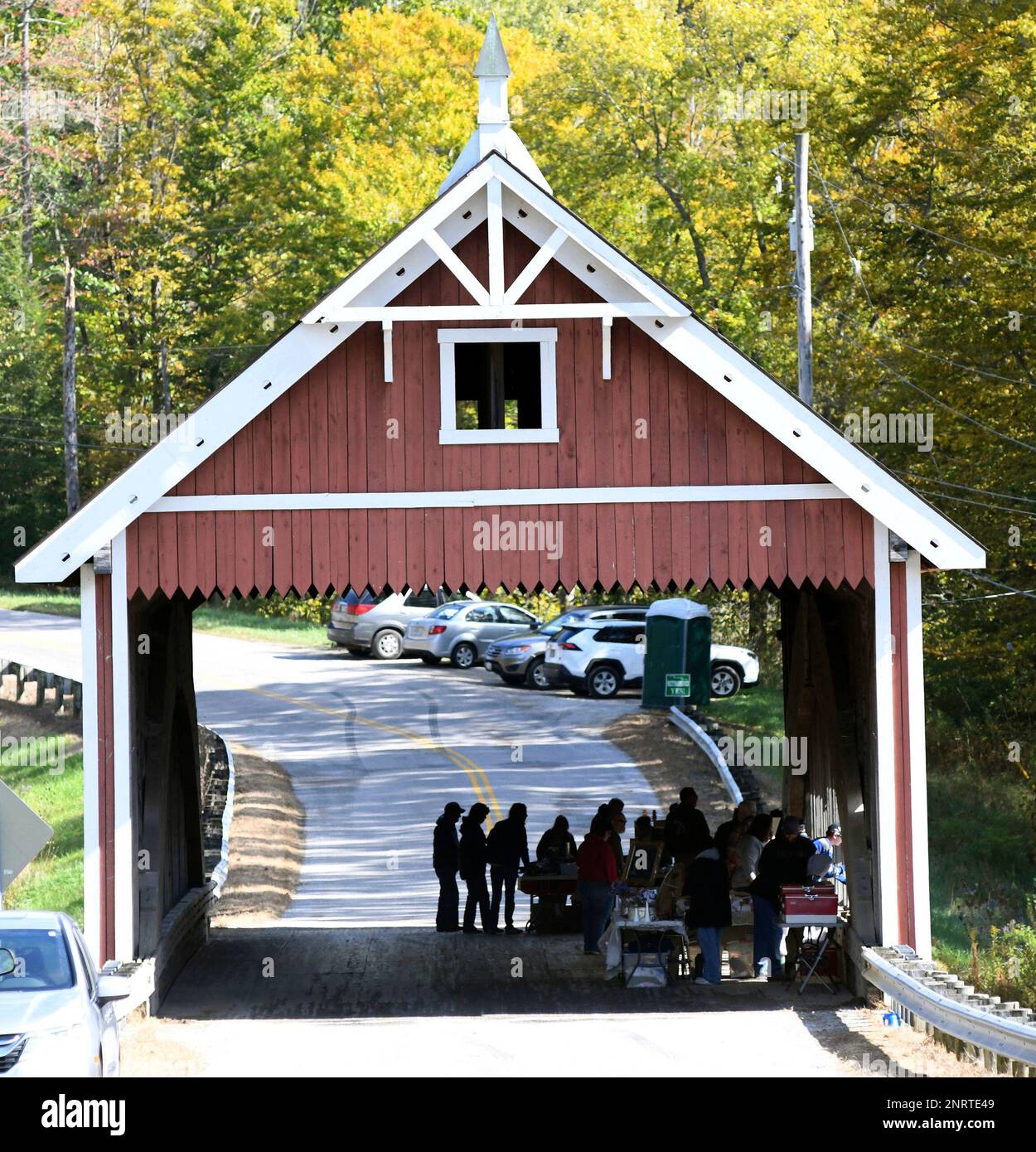 Visitors are silhouetted inside the Netcher Road Covered Bridge in ...