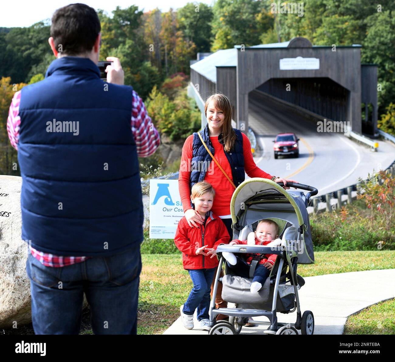 Ryan Ribblett takes a picture of his wife Kelly and their two children ...