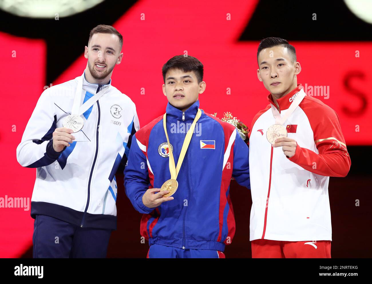 (L-R) Artem Dolgopyat of Israel, silver, Carlos Edriel Yulo of ...