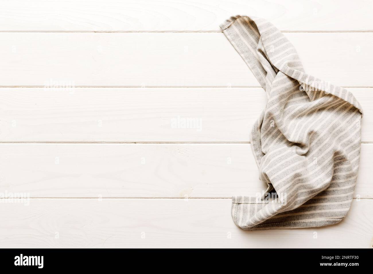 top view with gray kitchen napkin isolated on table background. Folded ...