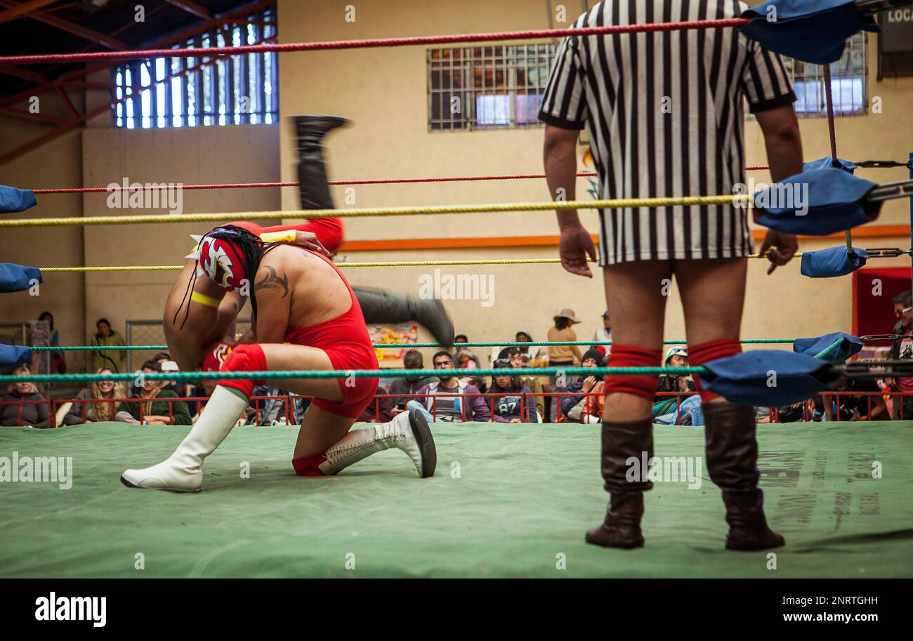 Lucha Libre. Wrestlers in combat, and referee, Sports center La Ceja ...