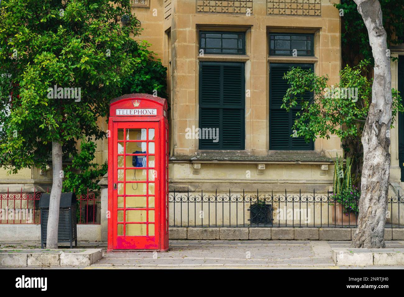 An iconic red telephone box in maltese town Mdina. Malta English ...