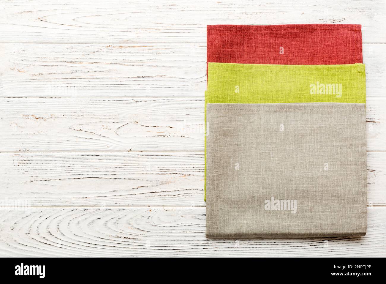 top view with gray kitchen napkin isolated on table background. Folded ...