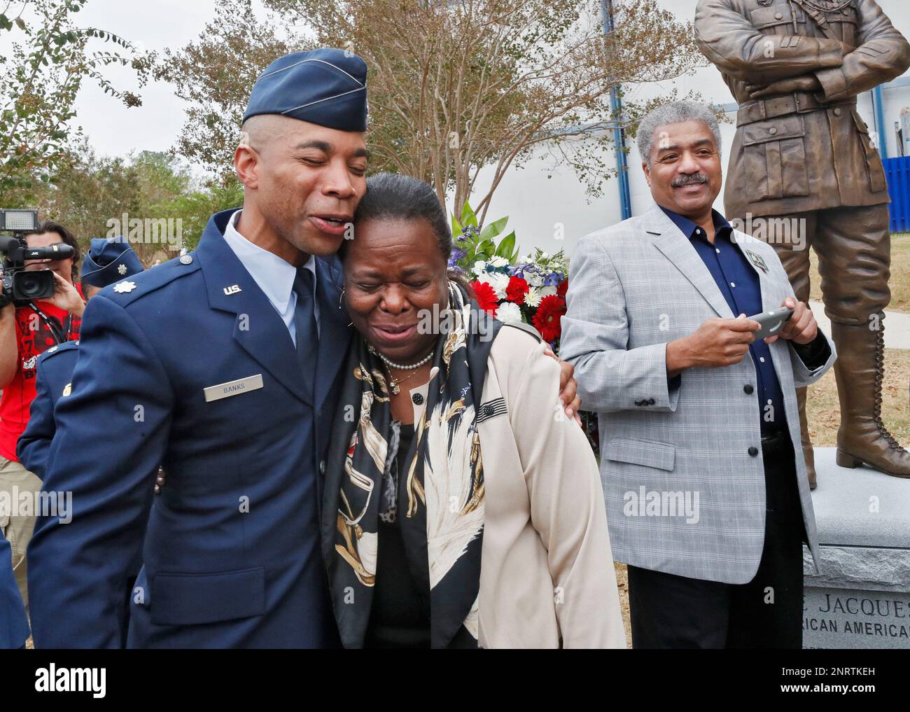 Harriett Bullard White, a descendent of Eugene Bullard, gets a hug from ...
