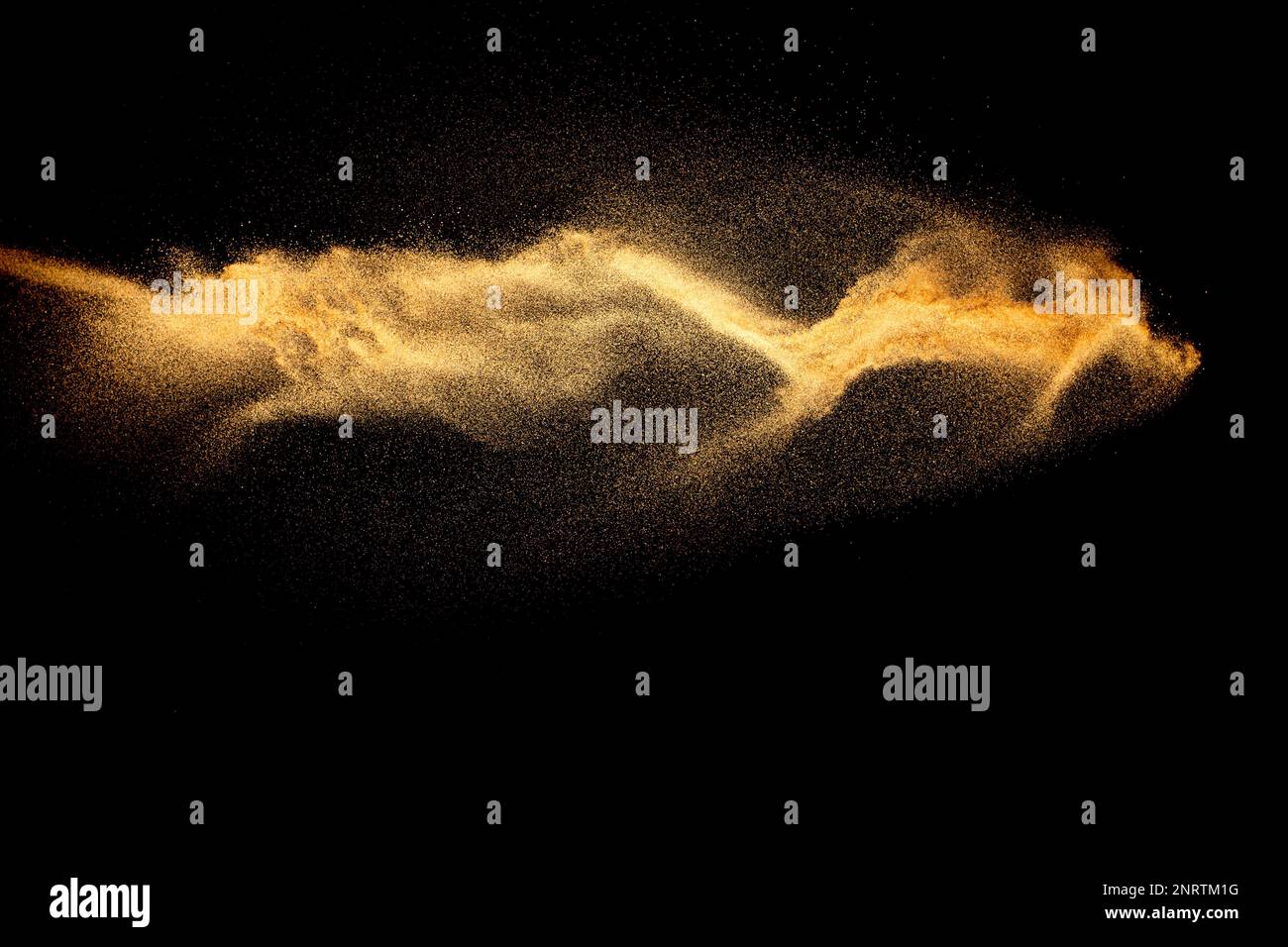 Dry river sand explosion.Brown color sand splash against black ...