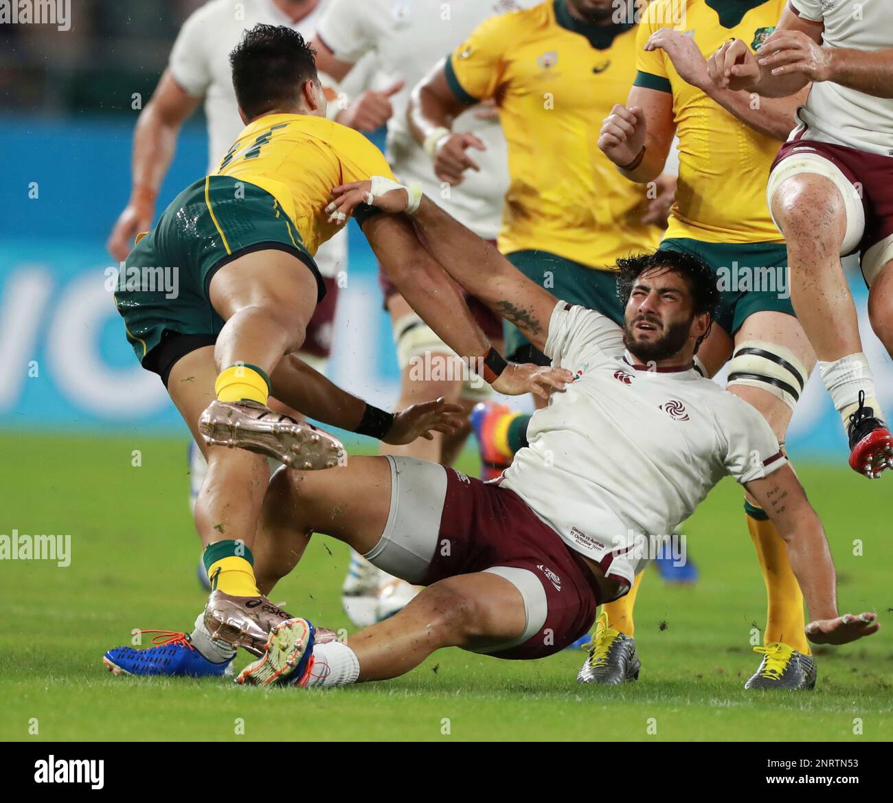Georgian Giorgi Kveseladze and Australian Jordan Petaia make a head-on ...