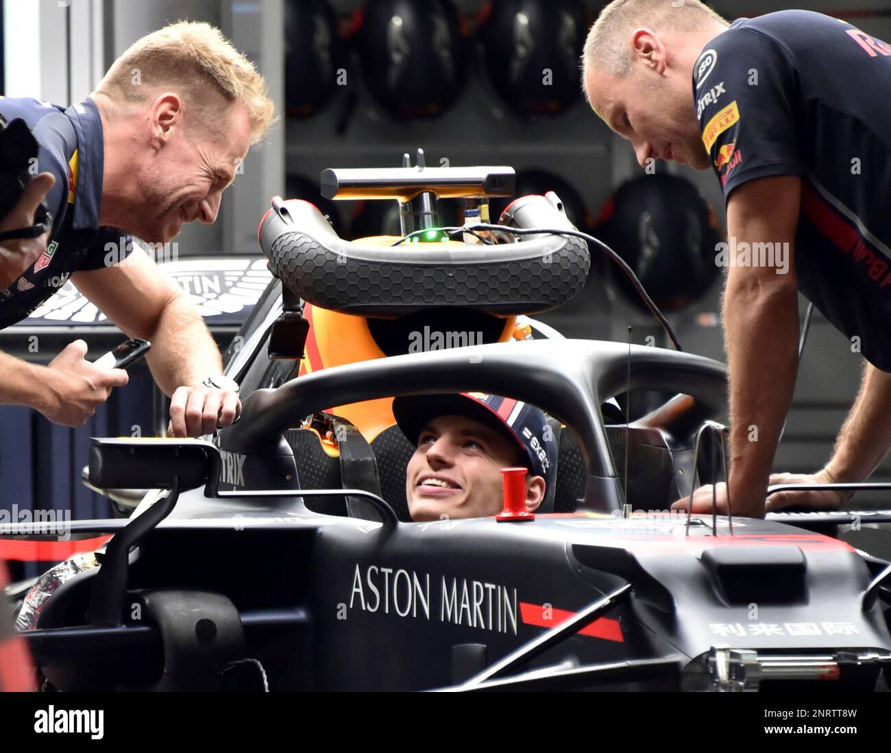Red Bull Racing F1 driver Max Verstappen (C) rides a machine at the ...
