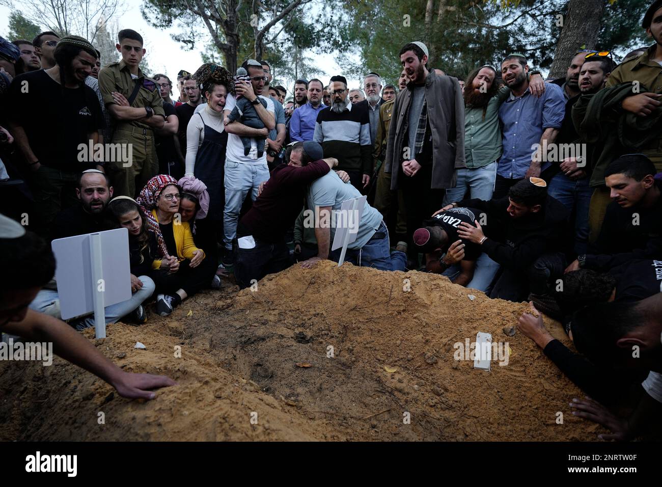 Family members and friends of Hillel Yaniv, 21, and Yagel Yaniv, 19 ...