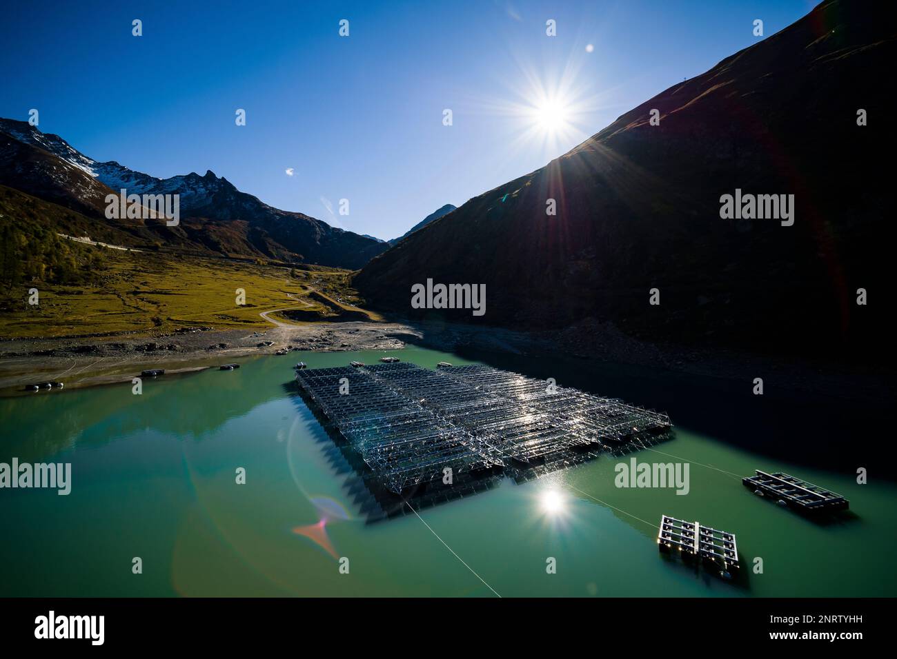 Floating barges with solar panels are pictured on the 'Lac des Toules ...