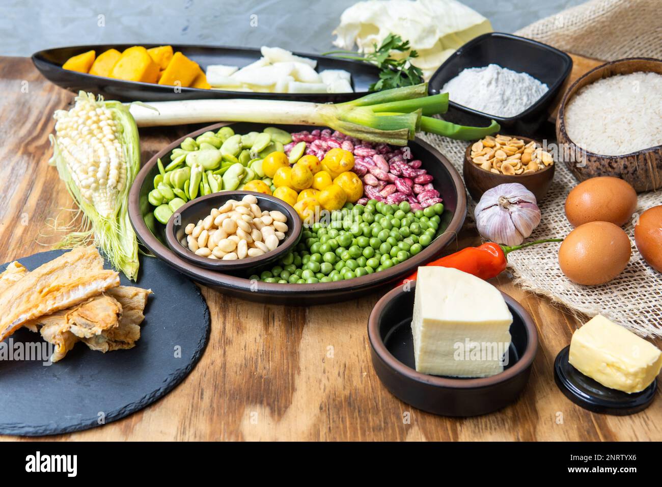 Cod, legumes and ingredients to prepare fanesca, a traditional soup ...