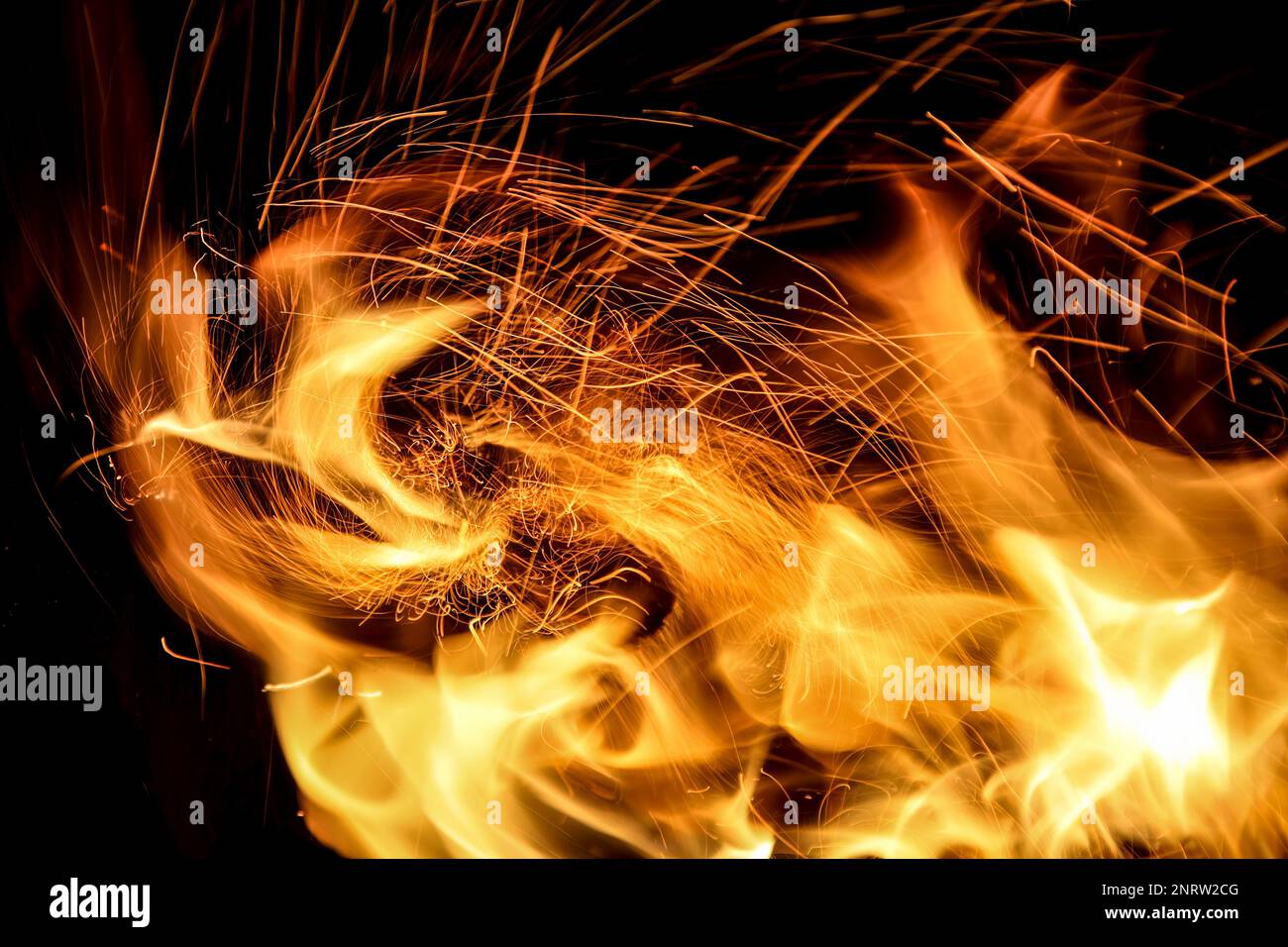 Fire with swirls of sparks in the night Stock Photo - Alamy