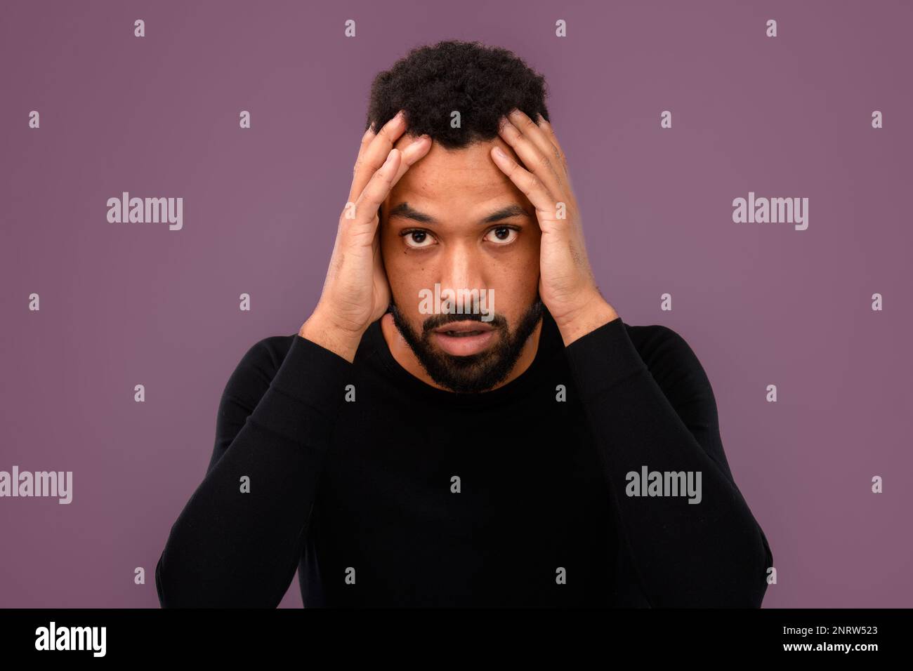 Portrait of young multiracial man in studio Stock Photo - Alamy