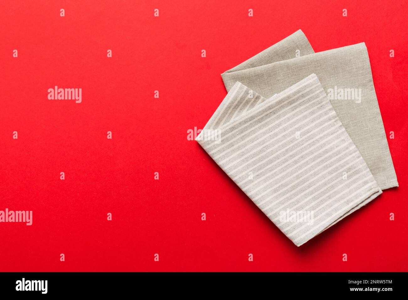top view with gray kitchen napkin isolated on table background. Folded ...