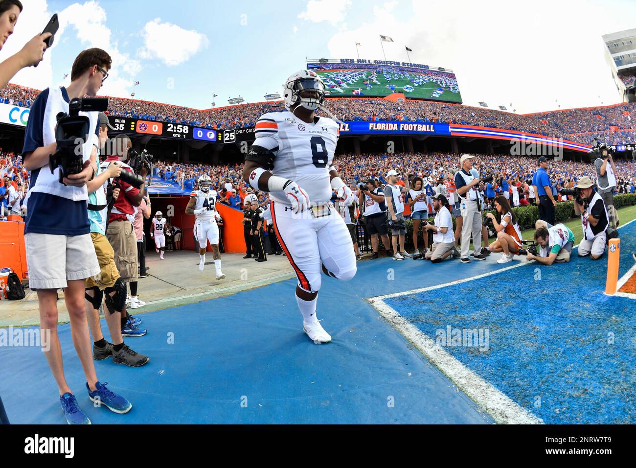 GAINESVILLE, FL - OCTOBER 05: Auburn defensive tackle Coynis Miller Jr. (8) enters the field ...