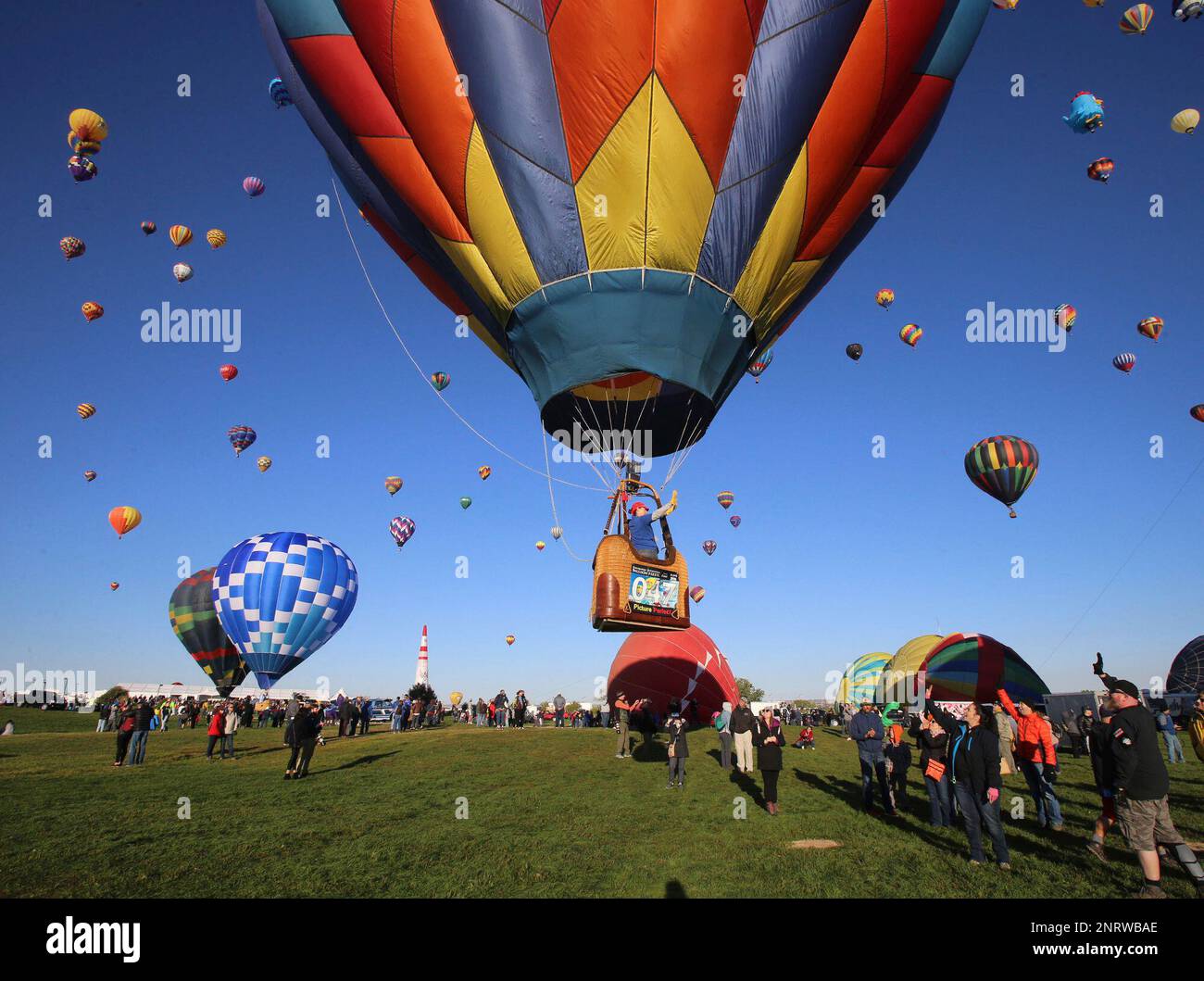 A balloonist lifts-off at the Albuquerque International Balloon Fiesta ...