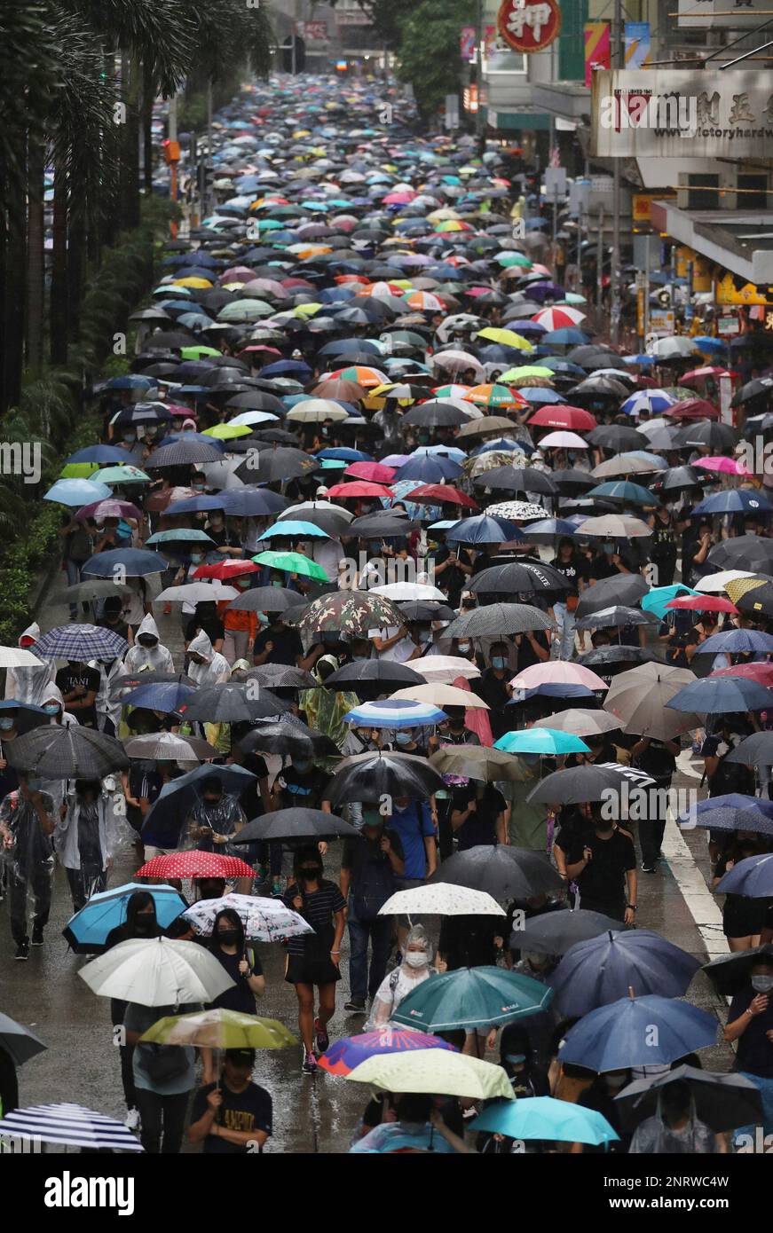 Anti-government protesters march in rain in Hong Kong on Oct. 6, 2019 ...
