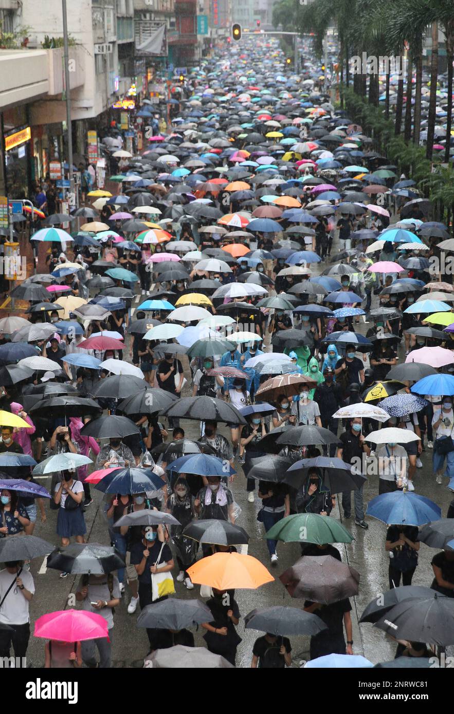 Anti-government protesters march in rain in Hong Kong on Oct. 6, 2019 ...