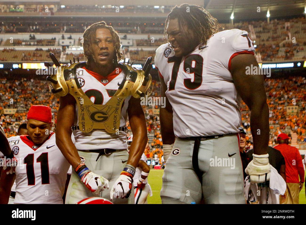 Georgia defensive back Eric Stokes (27) and offensive lineman Isaiah ...