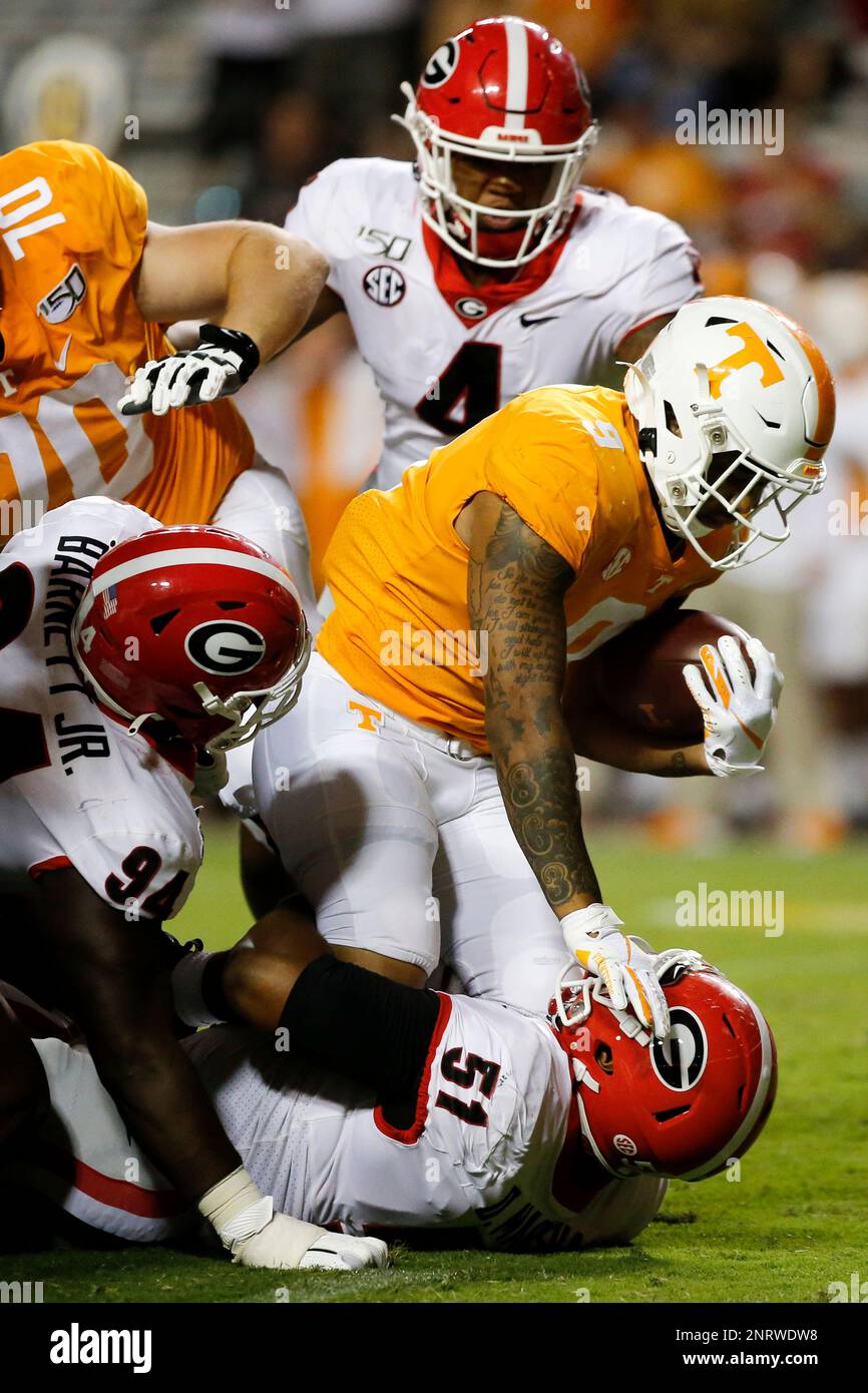 Georgia defensive end David Marshall (51) wraps up Tennessee running ...